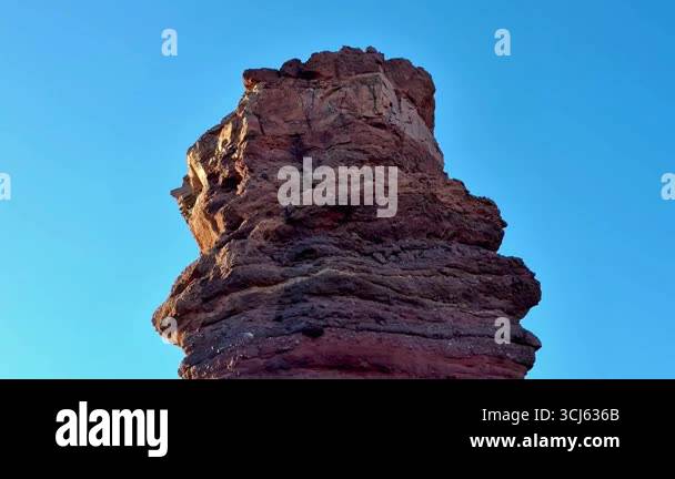 Explore a towering and magnificent rock formation that exhibits incredible natural beauty along ...