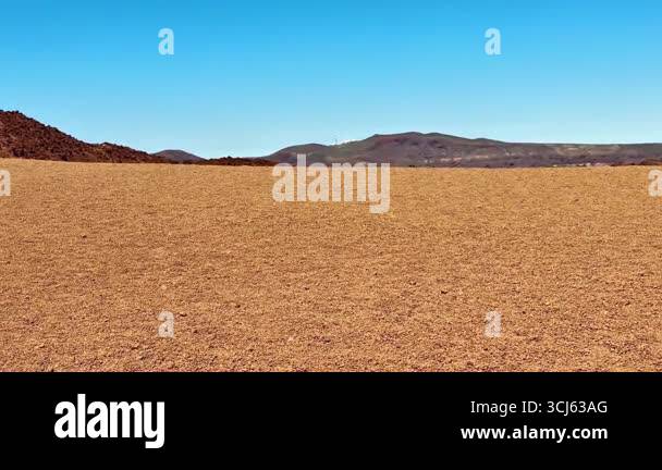 A stunning view of an expansive desert terrain featuring rolling red ...