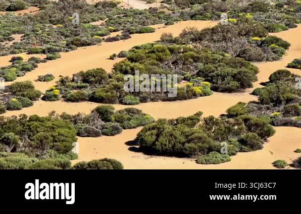 A stunning aerial view showcases a vast desert landscape merged with ...