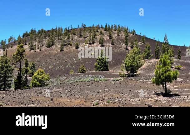 A stunning and picturesque volcanic hill is gracefully surrounded by ...