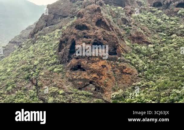 Explore a unique rock formation with captivating natural cavities in a ...