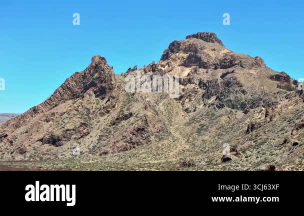 The breathtaking view showcases a rugged mountain range set in a vast ...