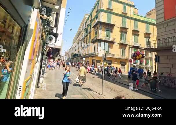Crowded alley with shops and street activity Stock Video Footage - Alamy