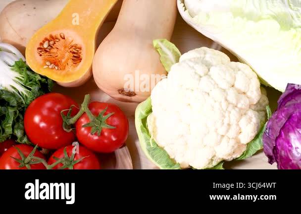 A vibrant assortment of fresh vegetables arranged neatly, showcasing ...