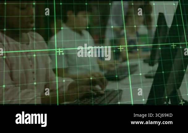 Student typing as green grid scans screen while teacher leaning ...