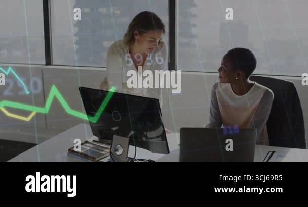 Standing business analyst pointing monitor showing animated graphs ...
