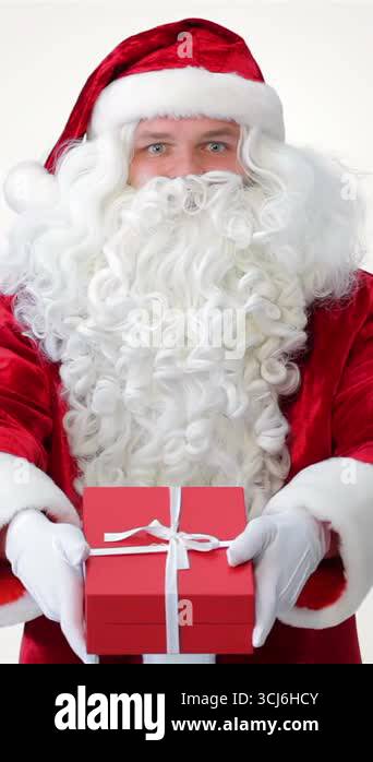 Jolly Santa Claus, with a twinkle in his eye and a fluffy white beard ...