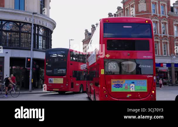 LONDON, UK - AUGUST 8, 2025 - Red double decker buses number 35 and 295 ...