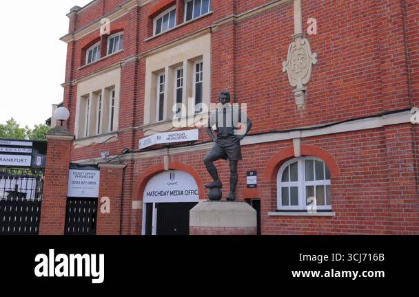 LONDON, UK - AUGUST 8, 2025 - Bronze statue of Johnny Haynes posing ...