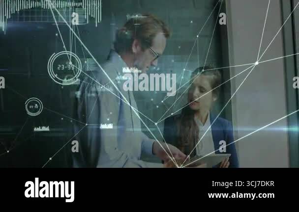 Colleagues swiping tablet, showing business charts and causing animated lines and numeric ...