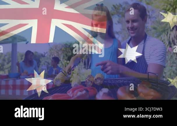 Girl receiving tongs from man flipping corn cobs for family cooking ...