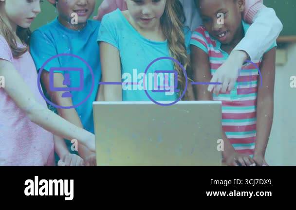 Children leaning over laptop and activating device icons while teacher ...