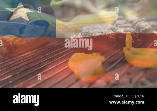 Hand pressing pepper slice on grill triggers skewers rotating for char ...