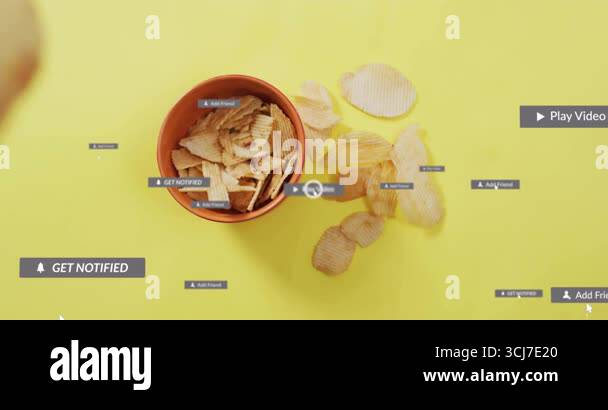 Play button fading over ceramic bowl with ridged chips spawning alerts ...