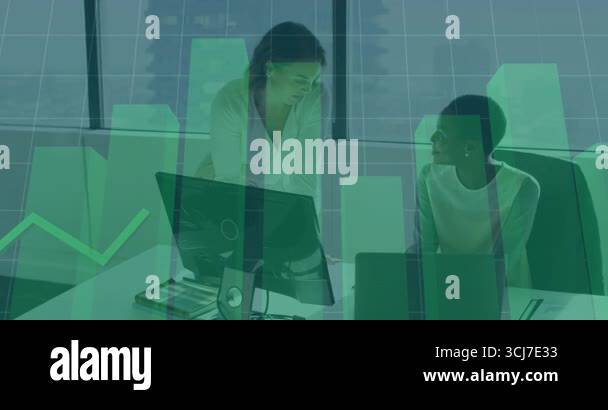 Business team leaning over laptop comparing data as green chart appears ...