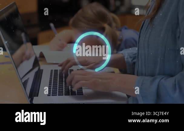 Mother typing on laptop guiding daughter writing in education notebook during spinner appearing ...