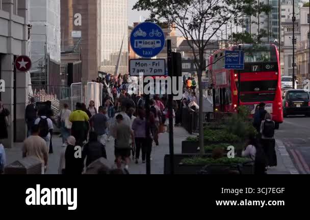 LONDON, UK - AUGUST 5, 2025 - People commuting in London are walking on ...