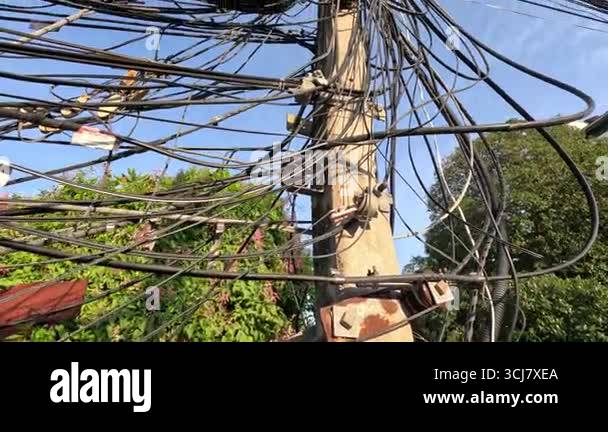 Tangled cables and wires on a utility pole Stock Video Footage - Alamy