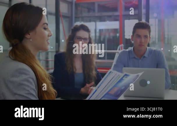 Presenter flipping charts at business table pointing graphs and handing ...