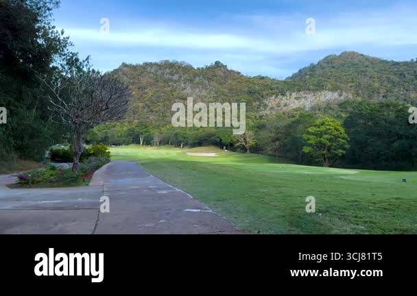 Peaceful golf course with mountain backdrop Stock Video Footage - Alamy