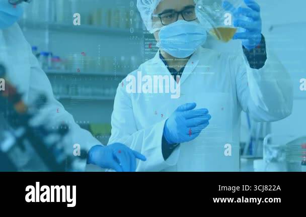 Female scientist pipetting sample into flask and male scientist ...