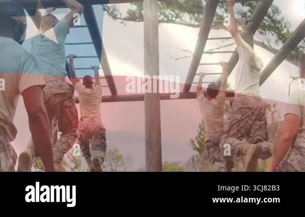 Soldiers jumping onto log and swinging across monkey bars ending in ...