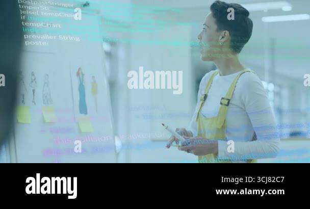 Female designer holding marker and initiating AR code overlay while ...