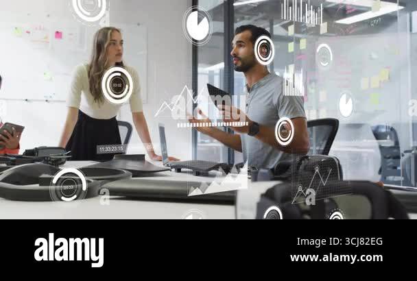 Engineer tapping tablet and showing animated performance charts while ...