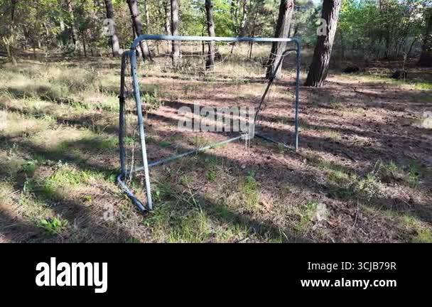 amateur football. football field in the forest. homemade football goals ...