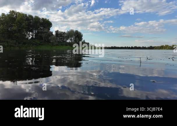 Slow motion video of water in a lake close up. Waves splashing foam in ...
