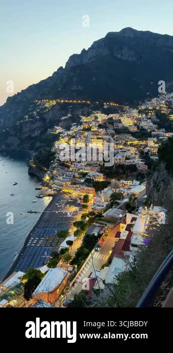 Experience the breathtaking transformation of Positano as day turns ...