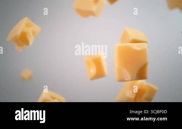 Super Slow Motion Shot of Cheese Cubes Falling Around Camera at 1000 fps. Filmed with High Speed ...