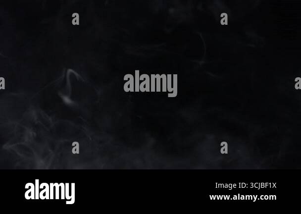 Super Slow Motion Shot of Atmospheric Smoke Slowly Floating on Black ...