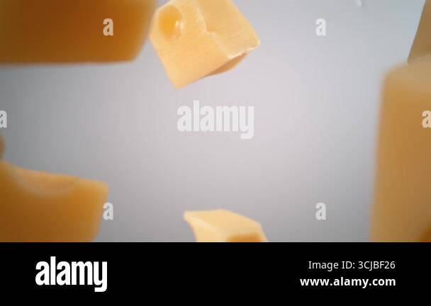 Super Slow Motion Shot of Cheese Cubes Falling Around Camera at 1000 ...