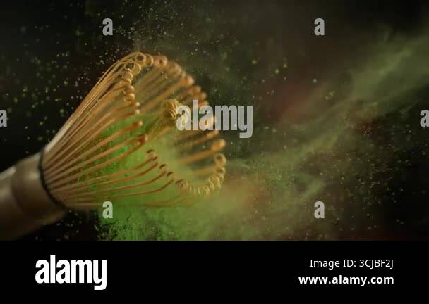 Super Slow Motion Shot of Flying Matcha Powder From Chasen Whisk with ...