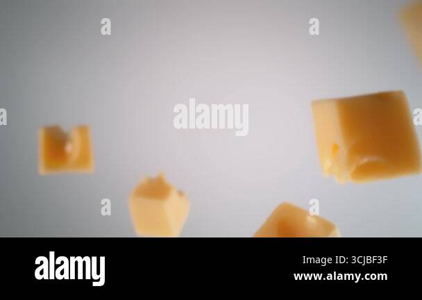 Super Slow Motion Shot of Cheese Cubes Falling Around Camera at 1000 ...