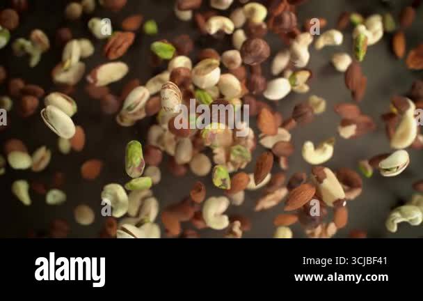 Super Slow Motion of Rotating and Flying Nut Mixture at 1000fps. Filmed ...