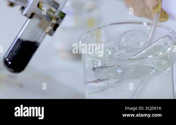 Chemical reaction producing gas bubbles in liquid Stock Video Footage ...