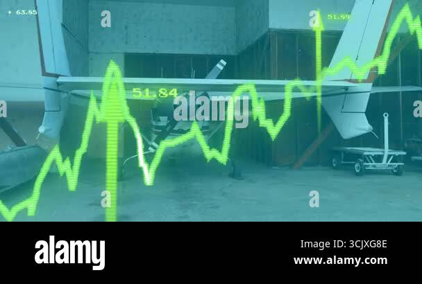 Green line graph scrolling over parked prop plane at hangar flashing ...