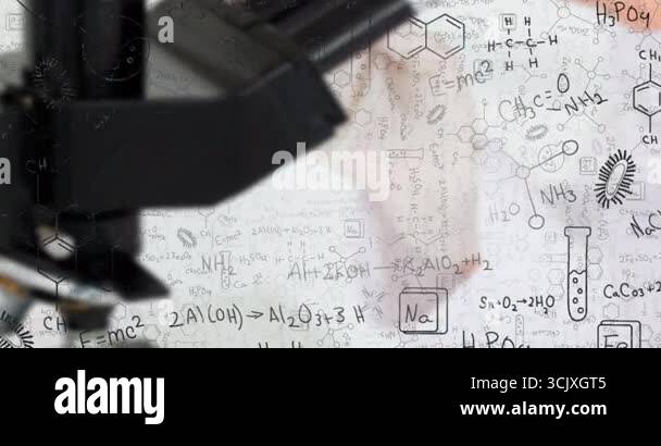Researcher's hand sweeping across clear board beside microscope ...