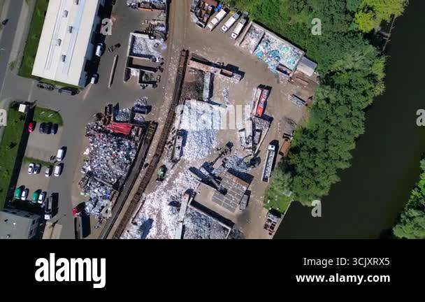 Aerial view of a scrap metal recycling center managing waste and ...