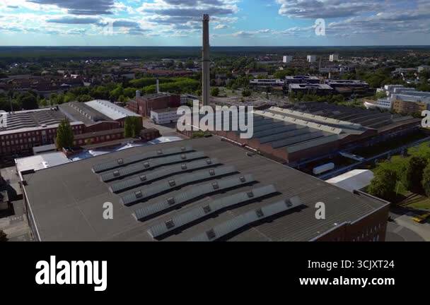 Aerial view of industrial buildings and a chimney in Hennigsdorf ...