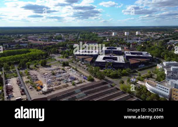 Aerial view of industrial buildings and a chimney in Hennigsdorf ...
