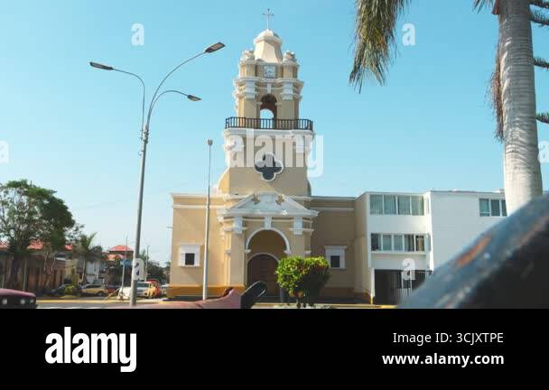 La Punta church tower with clock and plants in front, in Callao, peru ...