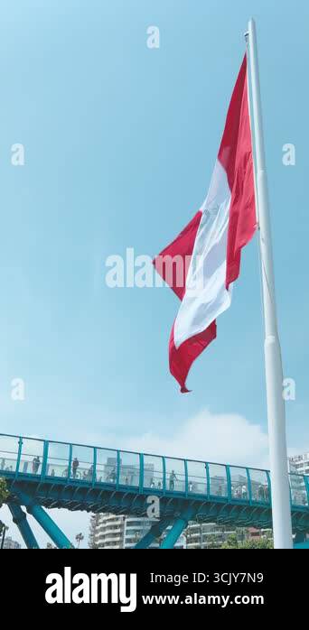 Peruvian flag waving in miraflores with the new la paz bridge in ...