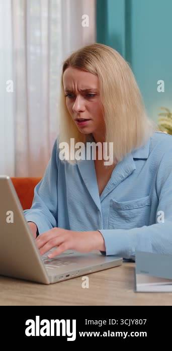 Frustrated Caucasian woman having software problems with laptop. Angry ...