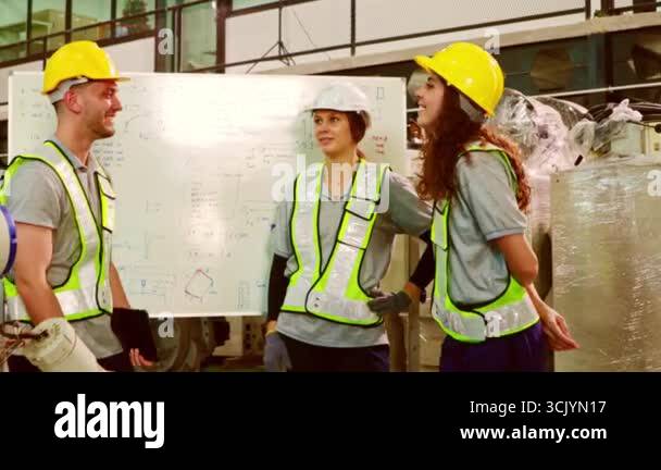 Group of male and female robot engineer workers meeting in robot warehouse office shaking hands ...