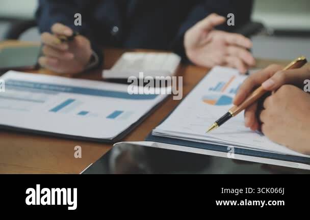 businesswomen working with laptop and financial documents at office ...