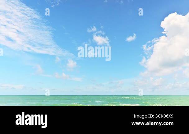 Fast motion of clouds in beautiful sunny day above the ocean. Time ...