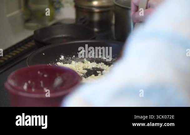 Woman making white sauce Stock Video Footage - Alamy